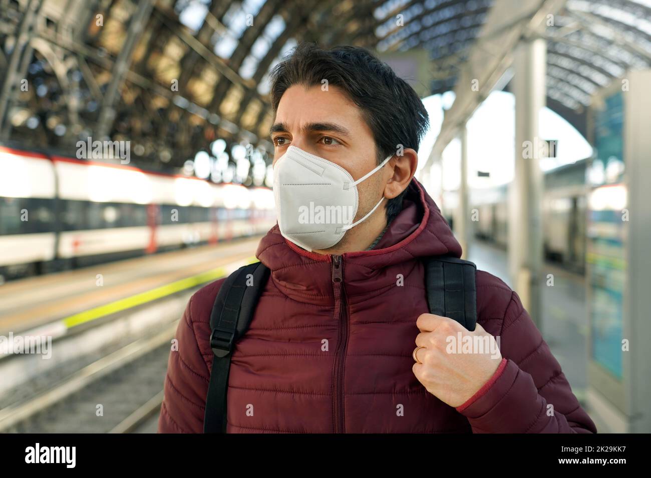 Portrait of traveler man wearing KN95 FFP2 medical face mask with ...