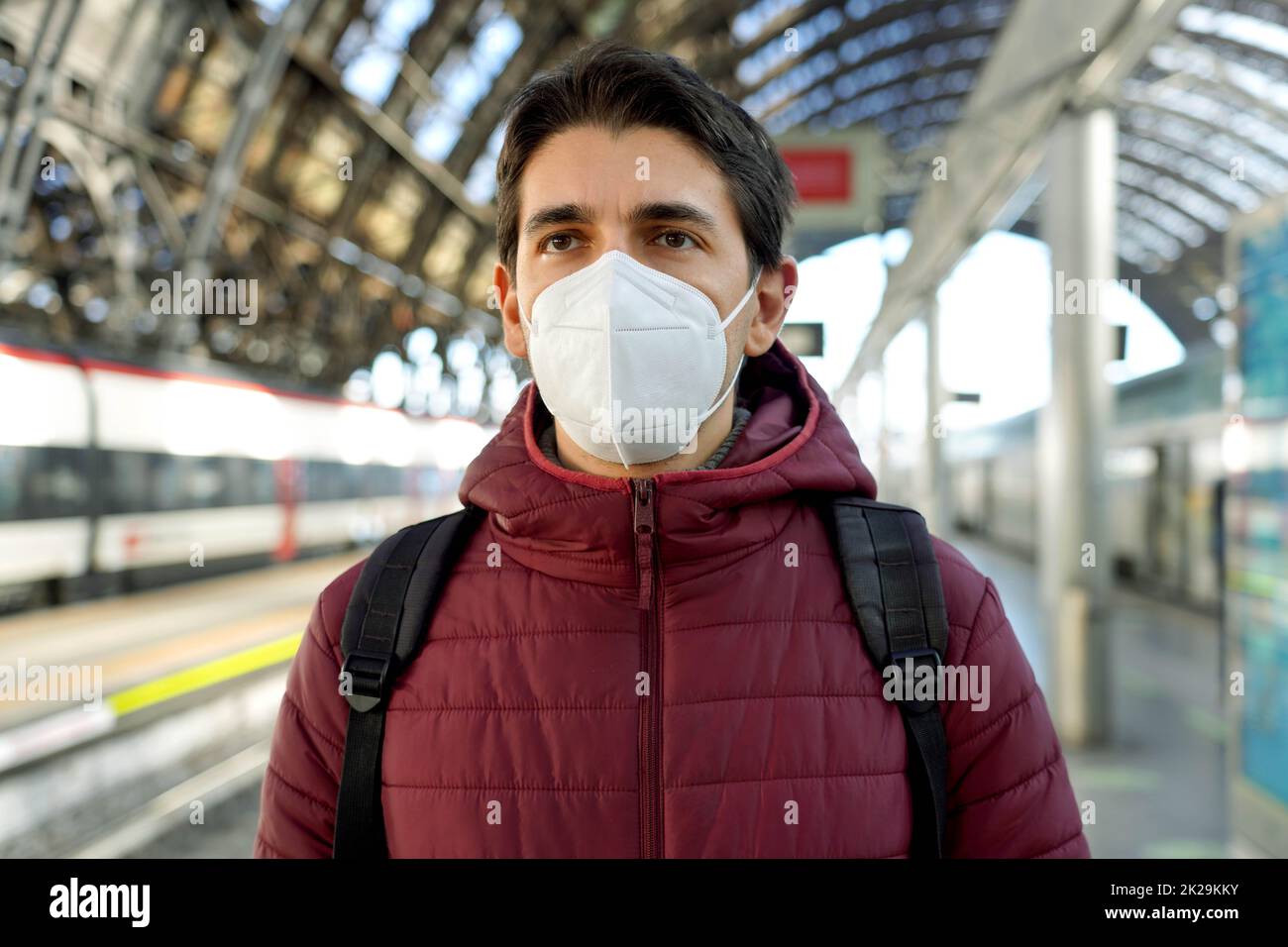 Portrait of traveler man wearing KN95 FFP2 medical face mask with ...