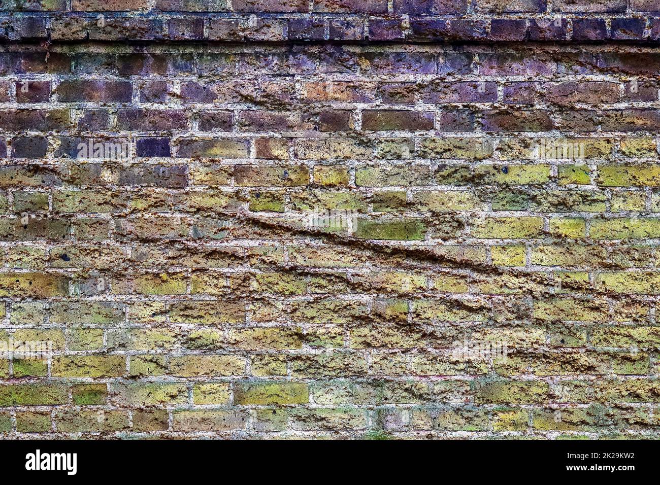 Detailed close up view on very old and weathered brick walls with ...