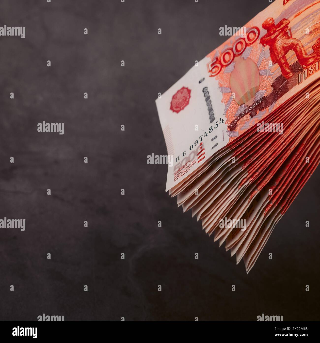 Russian rubles a large bundle on a gray background. A bundle of five ...