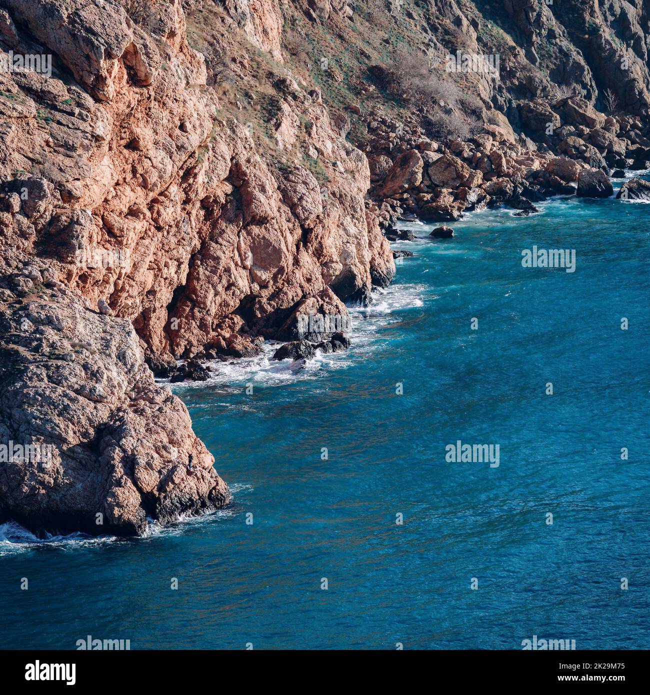 Landscape sea and rocks. The sea is an amazing blue color with ...