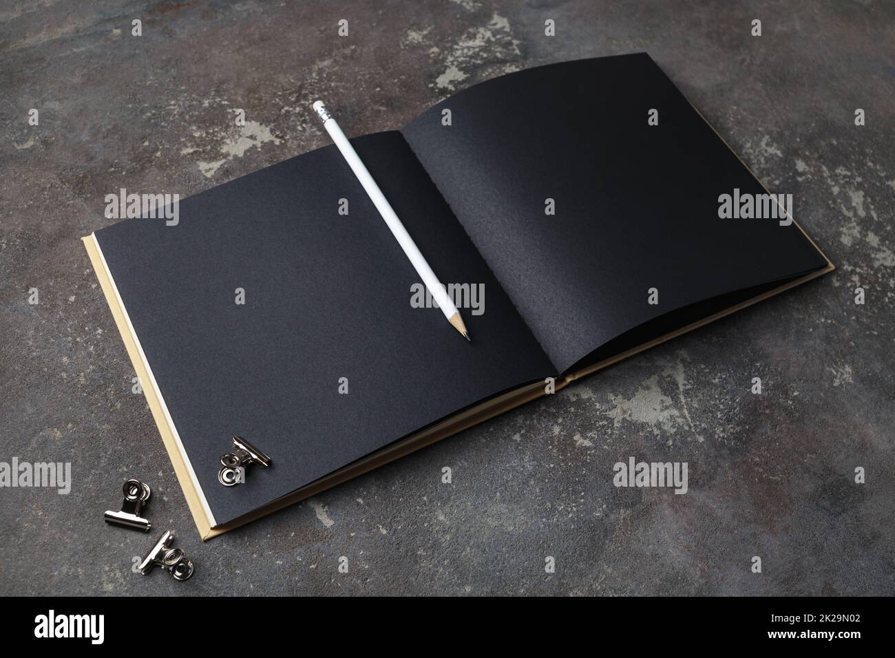 Black brochure, pencil Stock Photo - Alamy