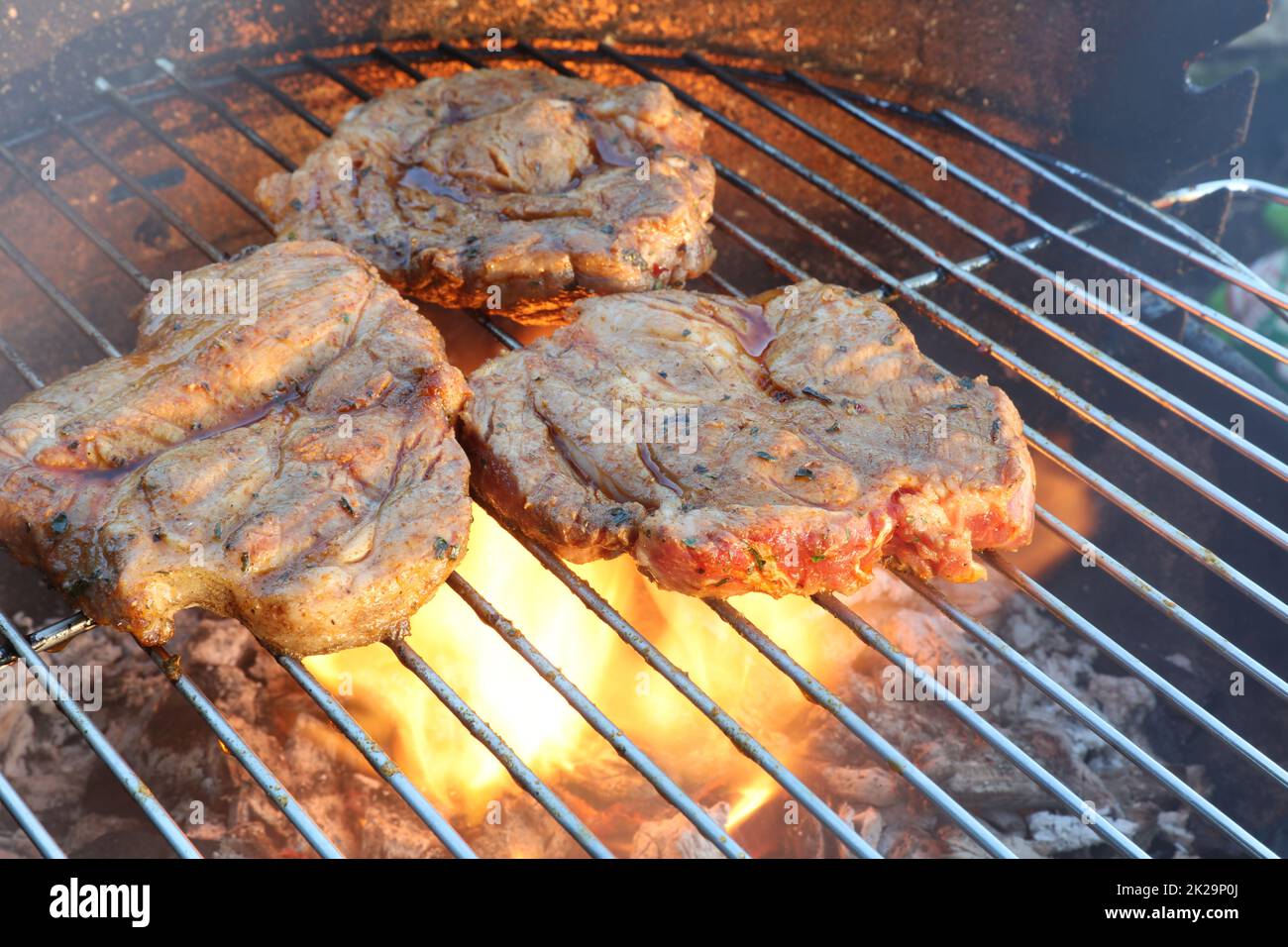 Steak on coal fired Barbecue Grill Stock Photo - Alamy