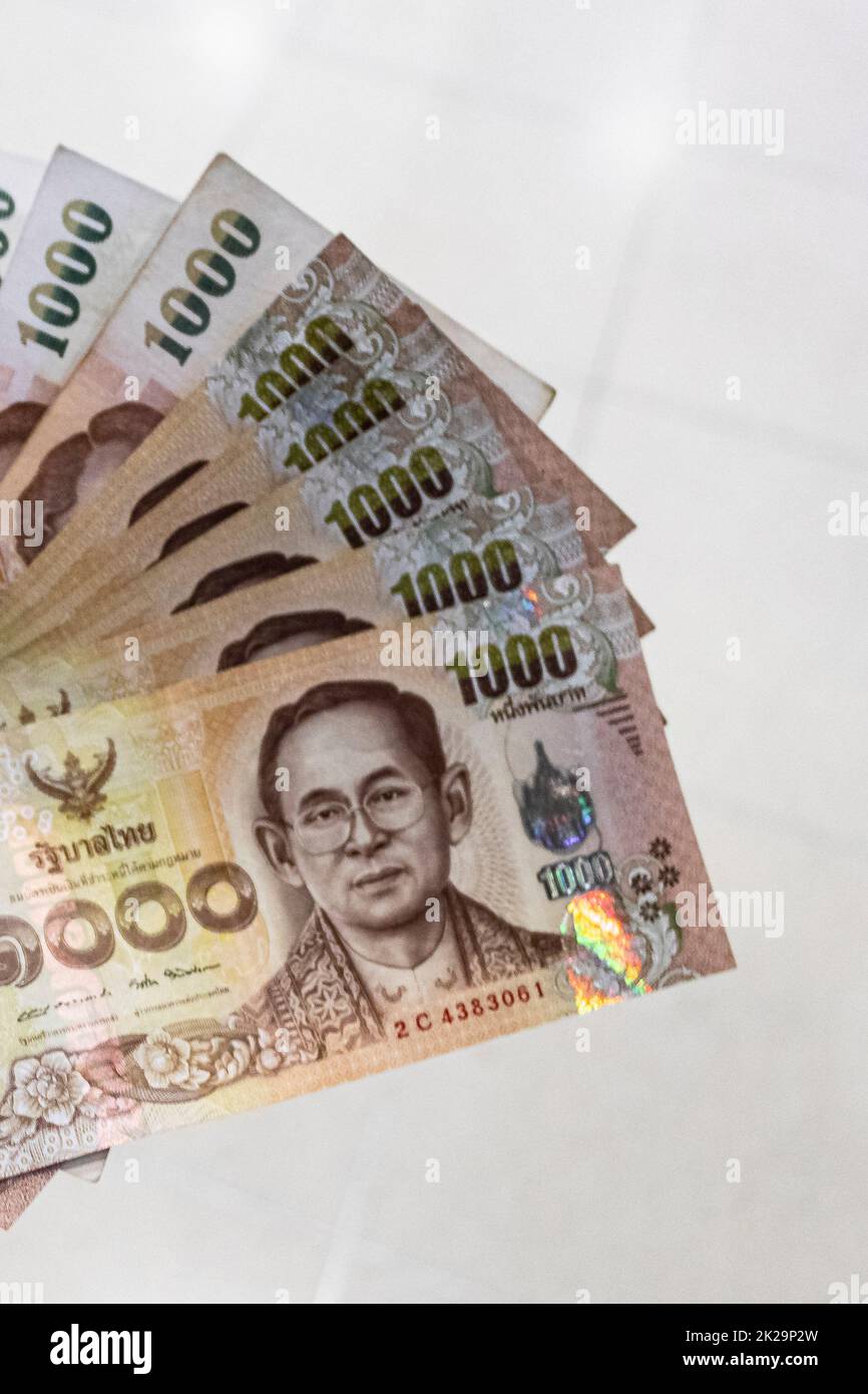 Thai money banknotes 8000 Thai Baht on white background Stock Photo - Alamy
