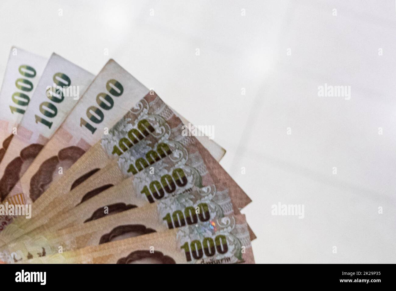Thai money banknotes 8000 Thai Baht on white background Stock Photo - Alamy