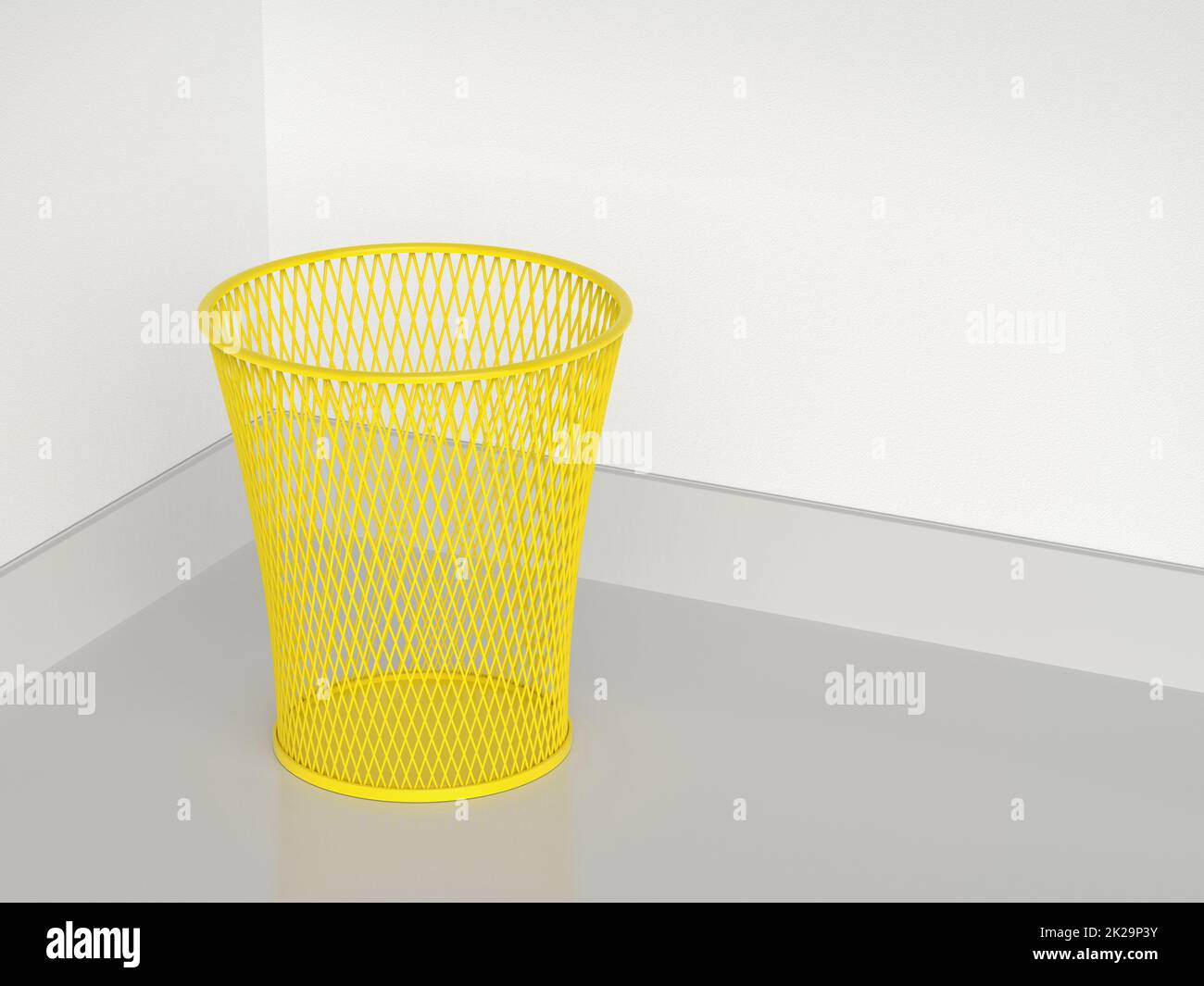 Yellow wastepaper basket Stock Photo - Alamy