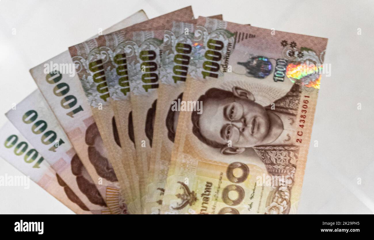 Thai money banknotes 8000 Thai Baht on white background Stock Photo - Alamy