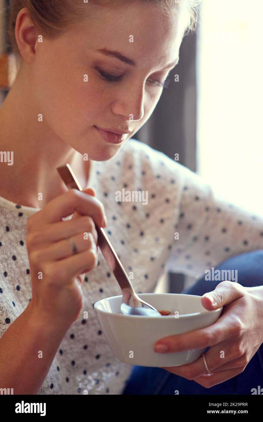 Healthy snacks for healthier living. a young woman eating a healthy ...
