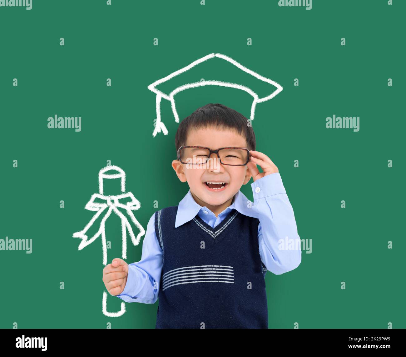 Happy child in graduation cap and holding the diploma against ...