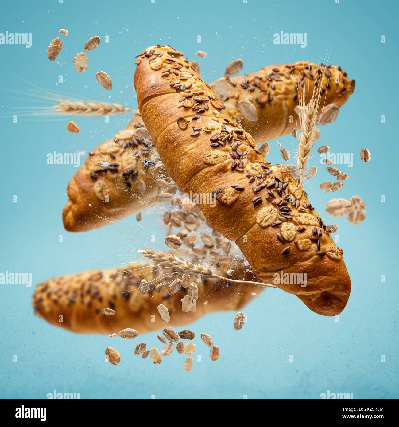 Freshly baked rolls fly in the air Stock Photo - Alamy