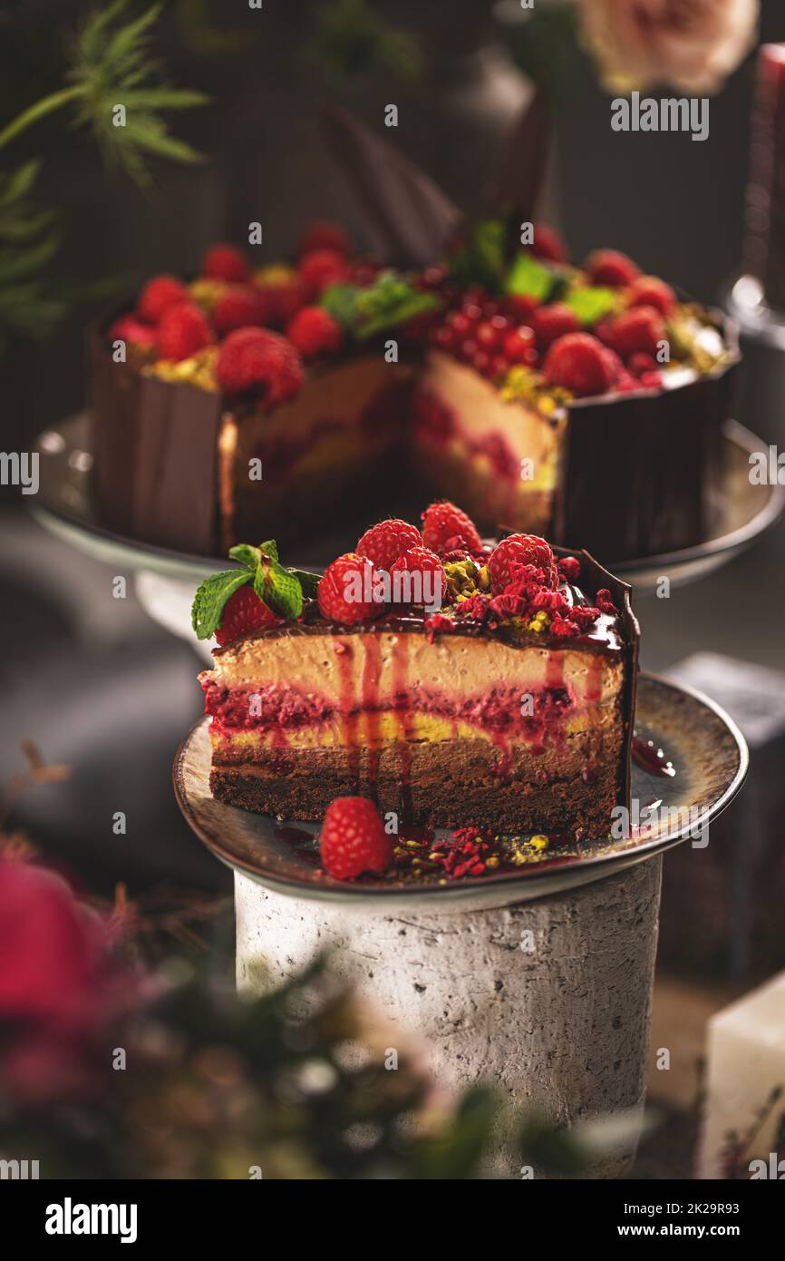 Slice of delicious layered mousse cake Stock Photo - Alamy