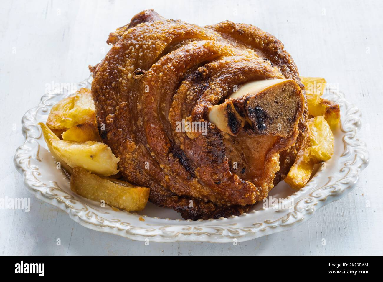 rustic german golden baked pork knuckle Stock Photo - Alamy