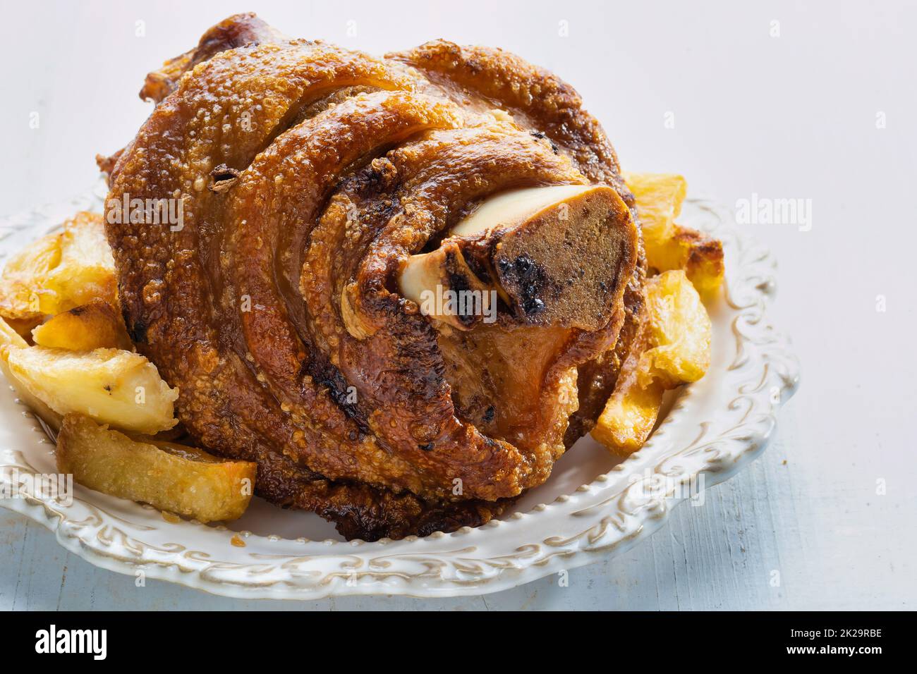 rustic german golden baked pork knuckle Stock Photo - Alamy