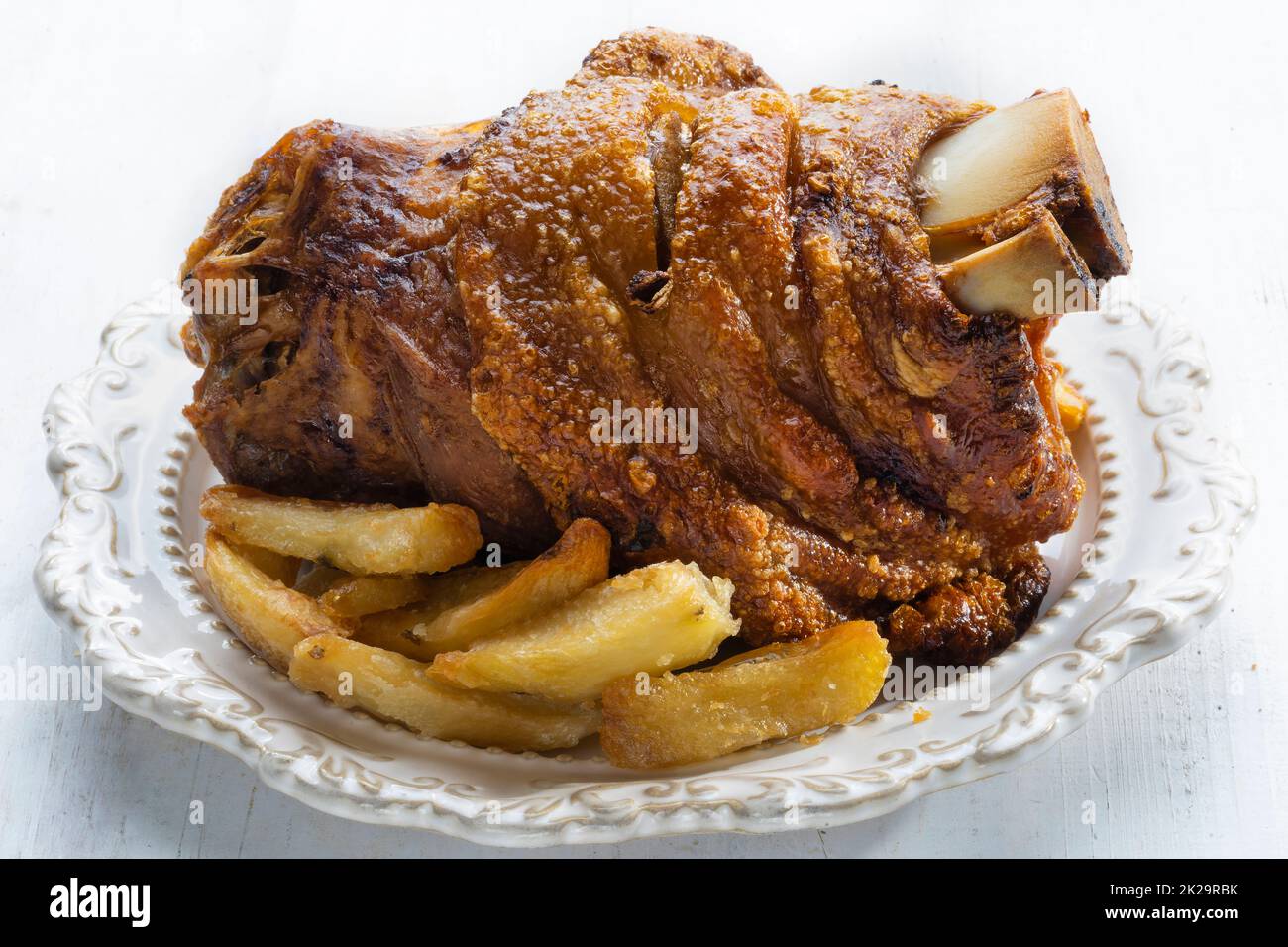 rustic german golden baked pork knuckle Stock Photo - Alamy