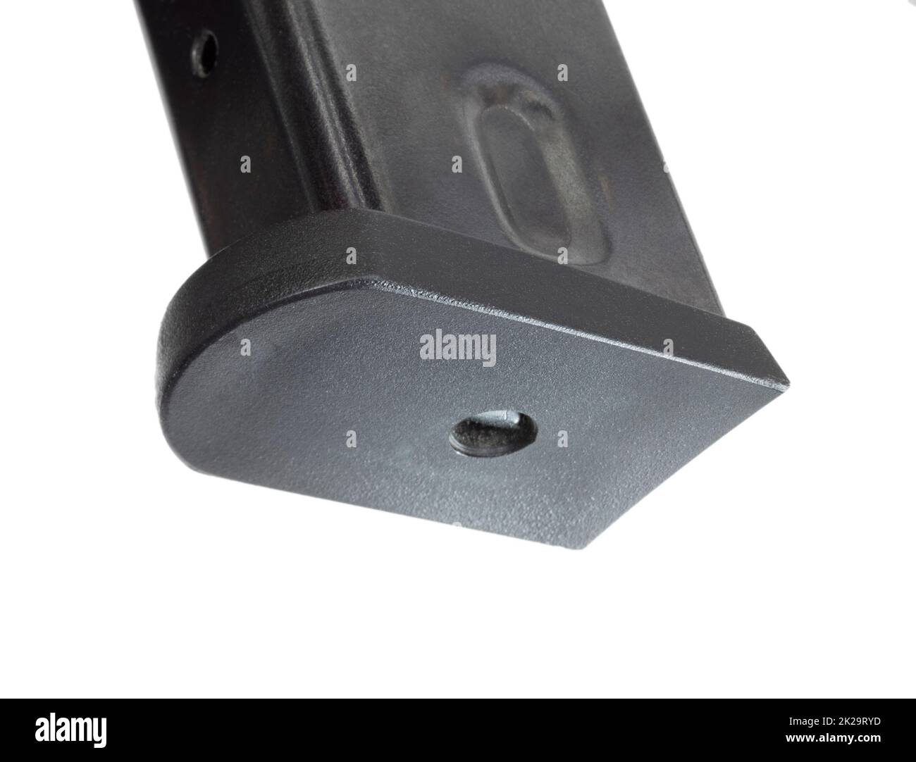 Button on the bottom of a pistol magazine that must be depressed to ...