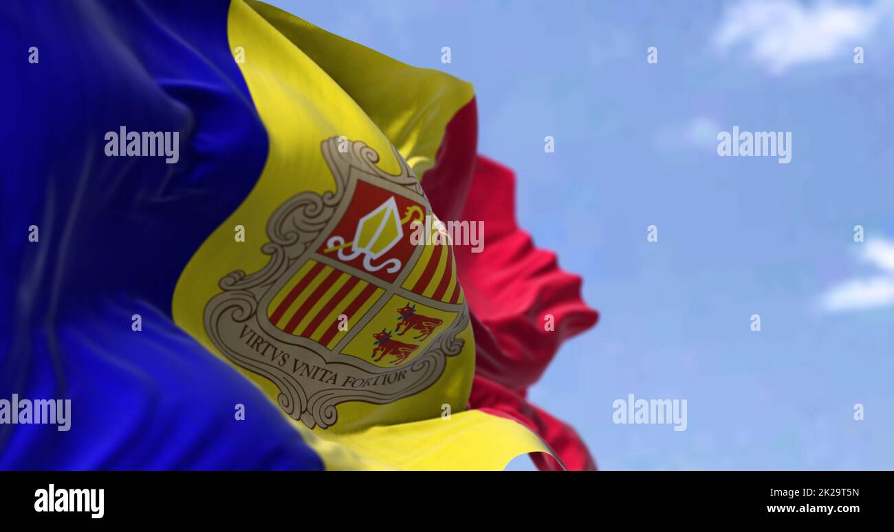 Detail of the national flag of Andorra waving in the wind on a clear da ...