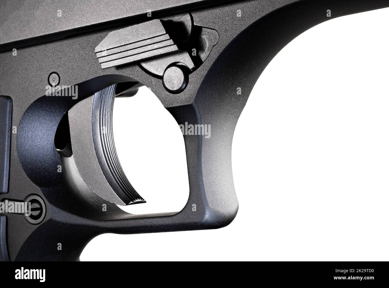 Large semi-automatic handgun trigger closeup isolated on a white ...