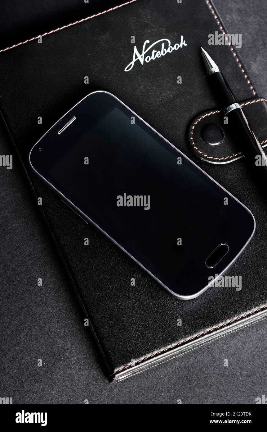 Mobile phone and notebook hi-res stock photography and images - Alamy