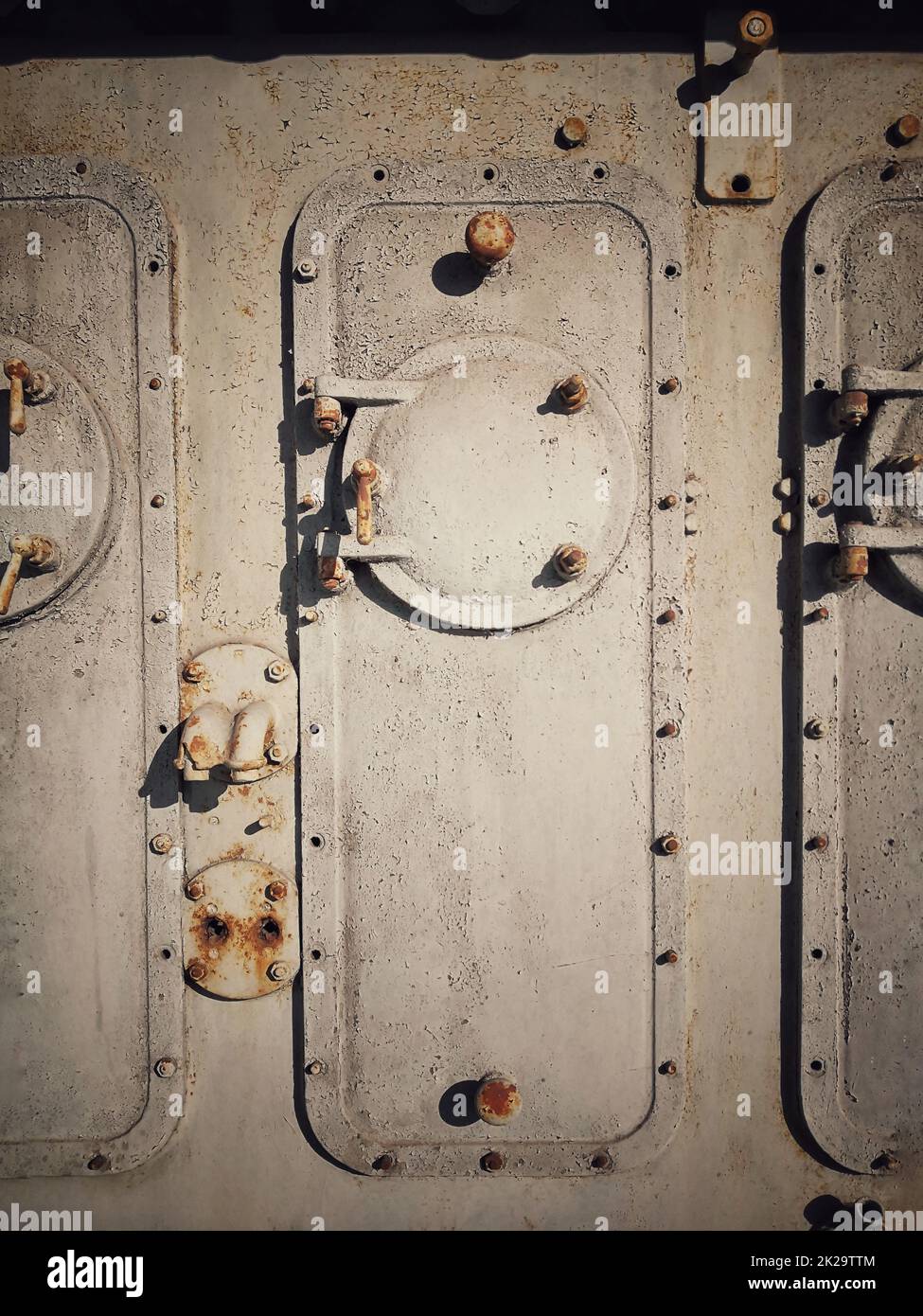 Rusty steel hatch door secured with nuts and bolts Stock Photo - Alamy