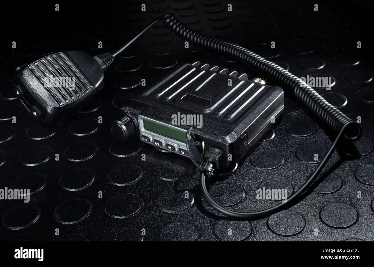 Two way radio with microphone and cord on a rubber background Stock ...