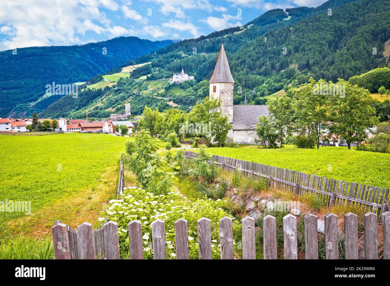 Idyllic alpine village of Burgeis and Abbey of Monte Maria view Stock ...