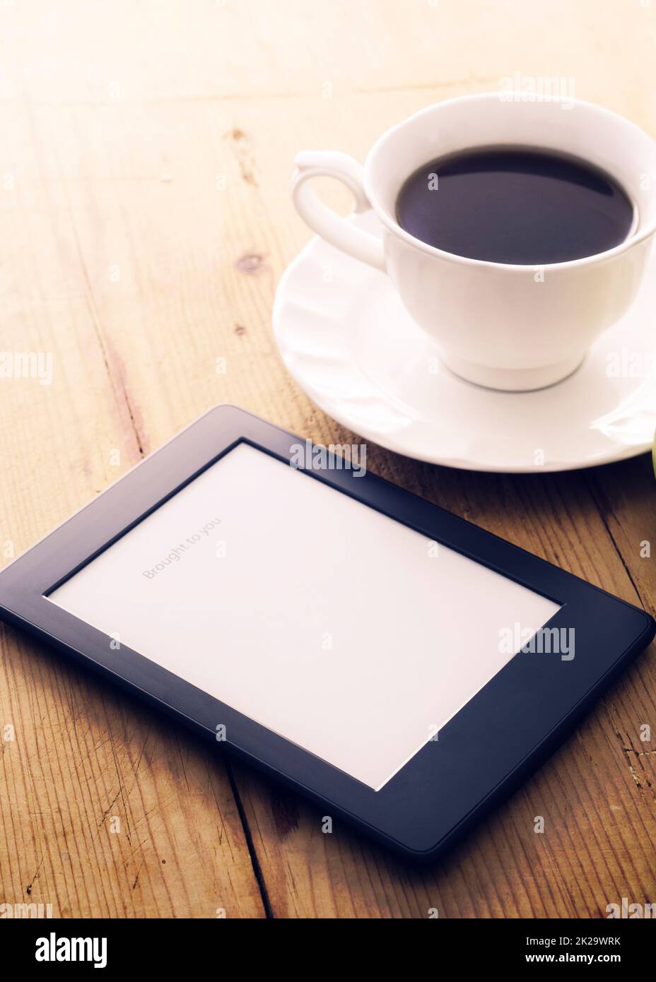 E-book reader and coffee Stock Photo - Alamy