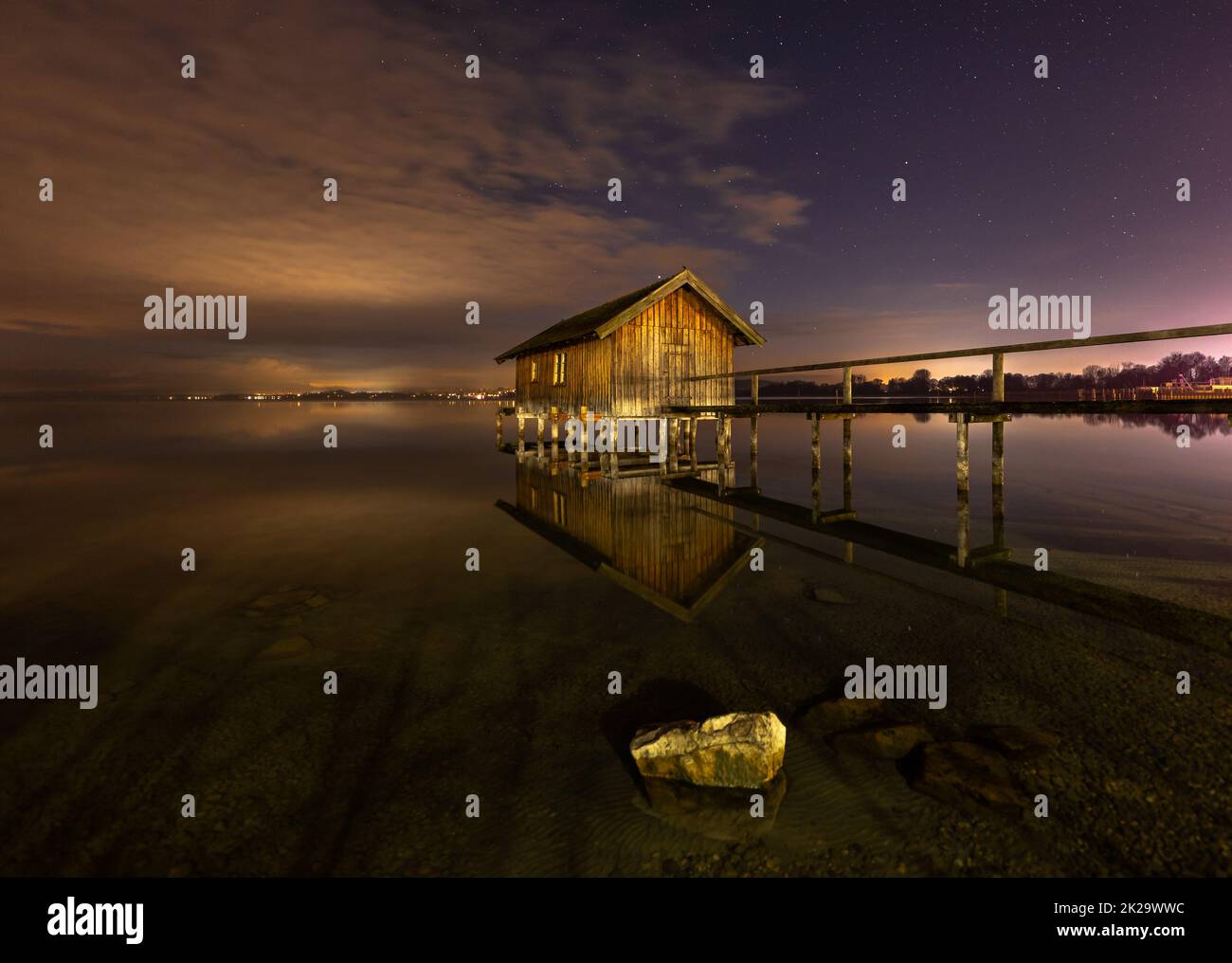 Boathouse in the village of Stegen, Lake Ammersee, Bavaria, Germany, at ...