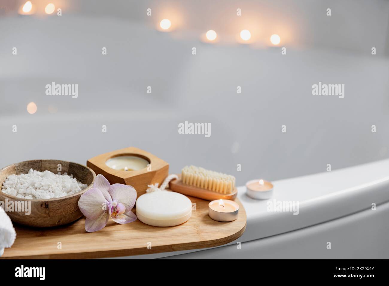 Hotel spa treatment or home bath procedure. Bathroom with accessories ...