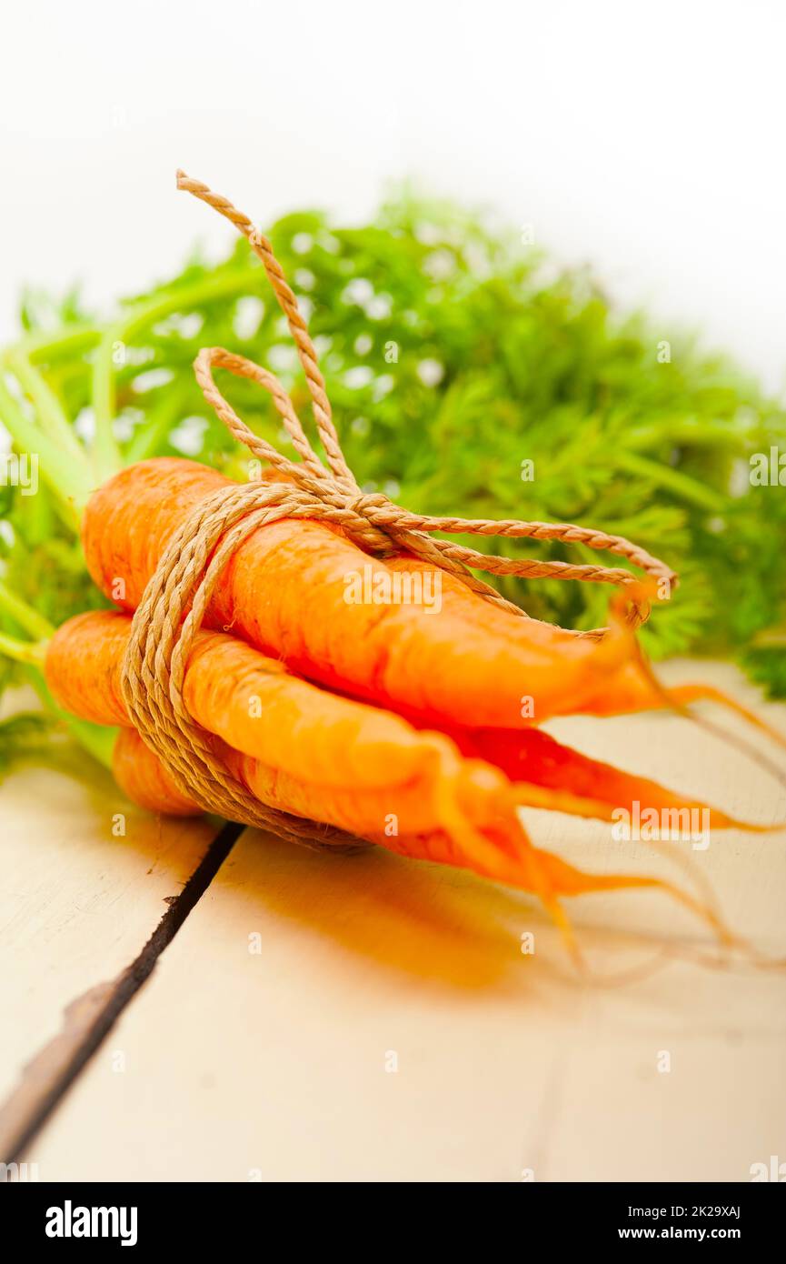 baby carrots bunch tied with rope Stock Photo - Alamy