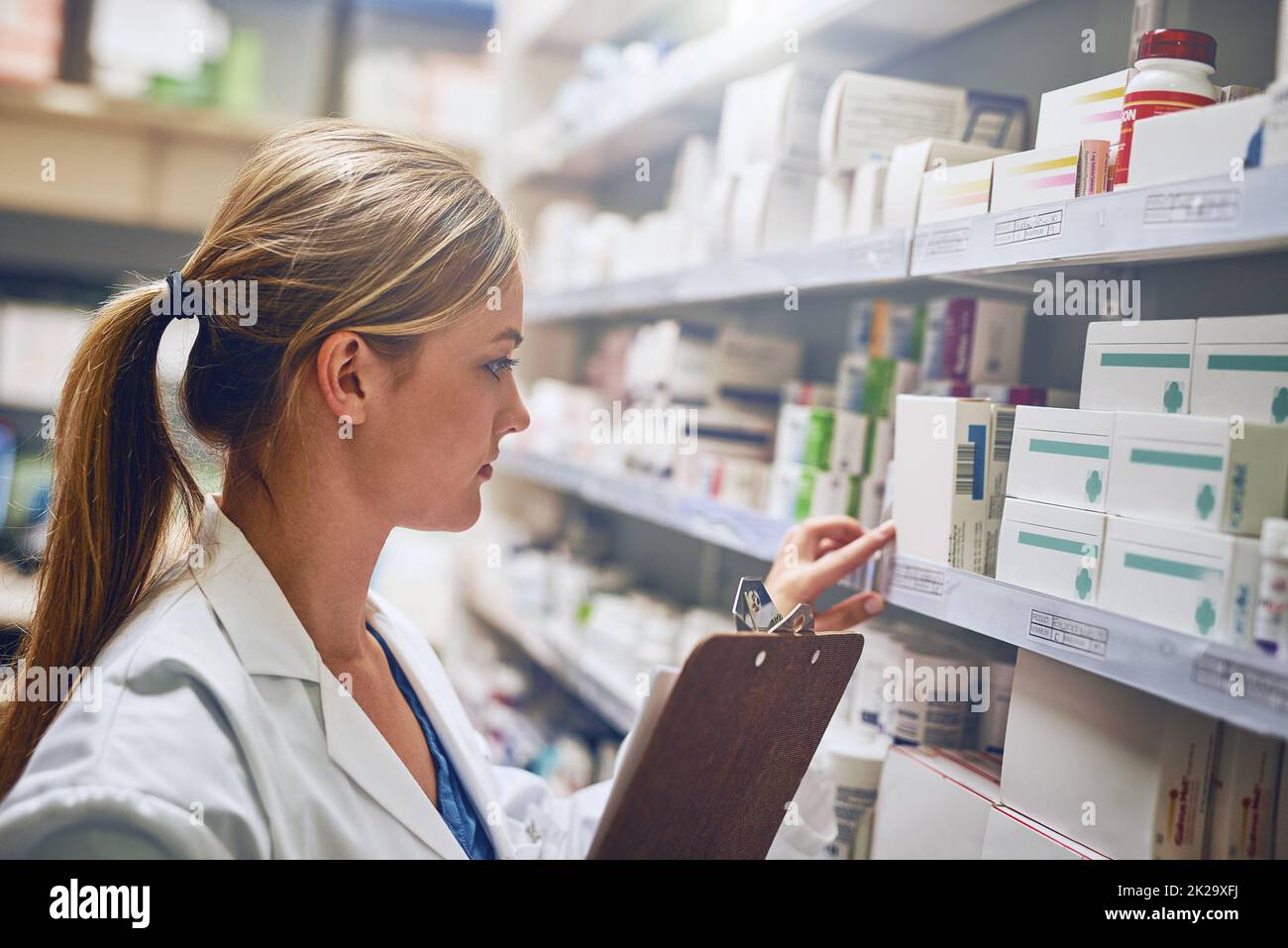Shell change your live for the better. Shot of a pharmacist looking at ...