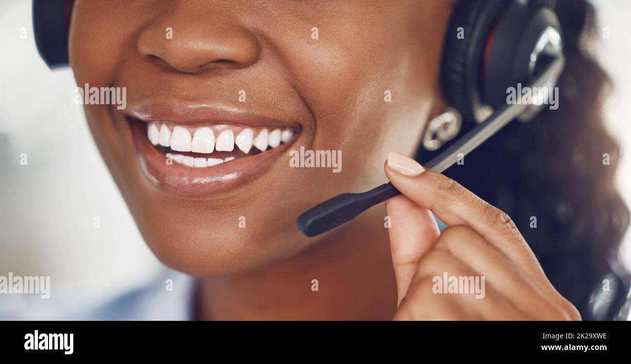 Call center agent, smile and black woman telemarketing operator or consultant talking on headset ...