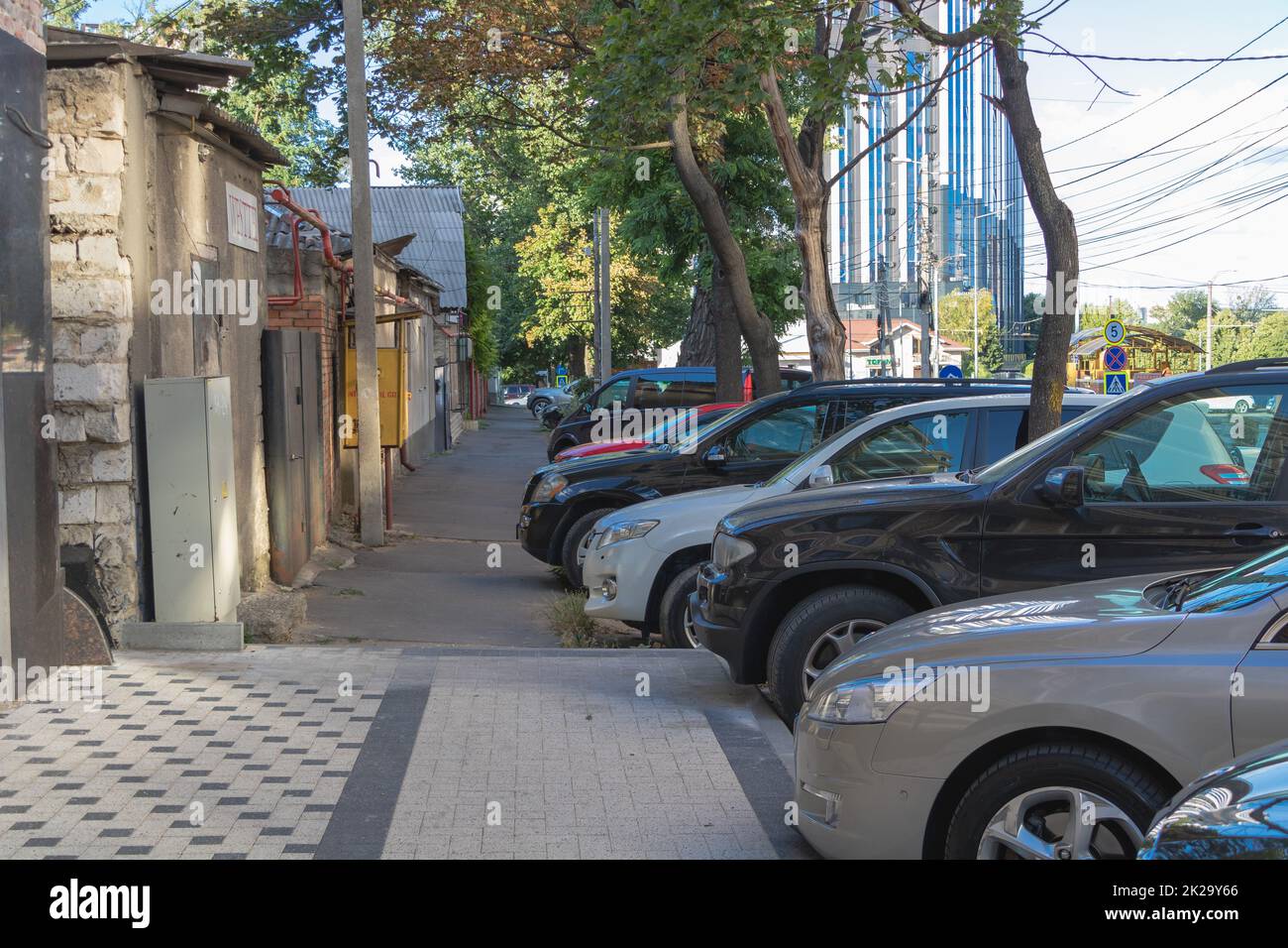 Chisinau, Moldova - August 2, 2022 Cars parked next to the sidewalk on ...