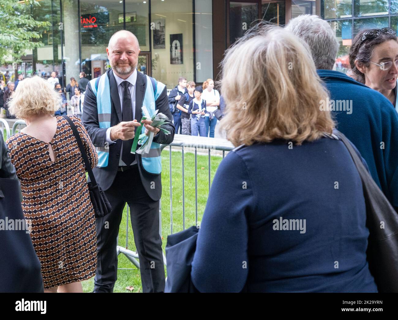 Members of the public queue back to tower bridge to pay their respects ...