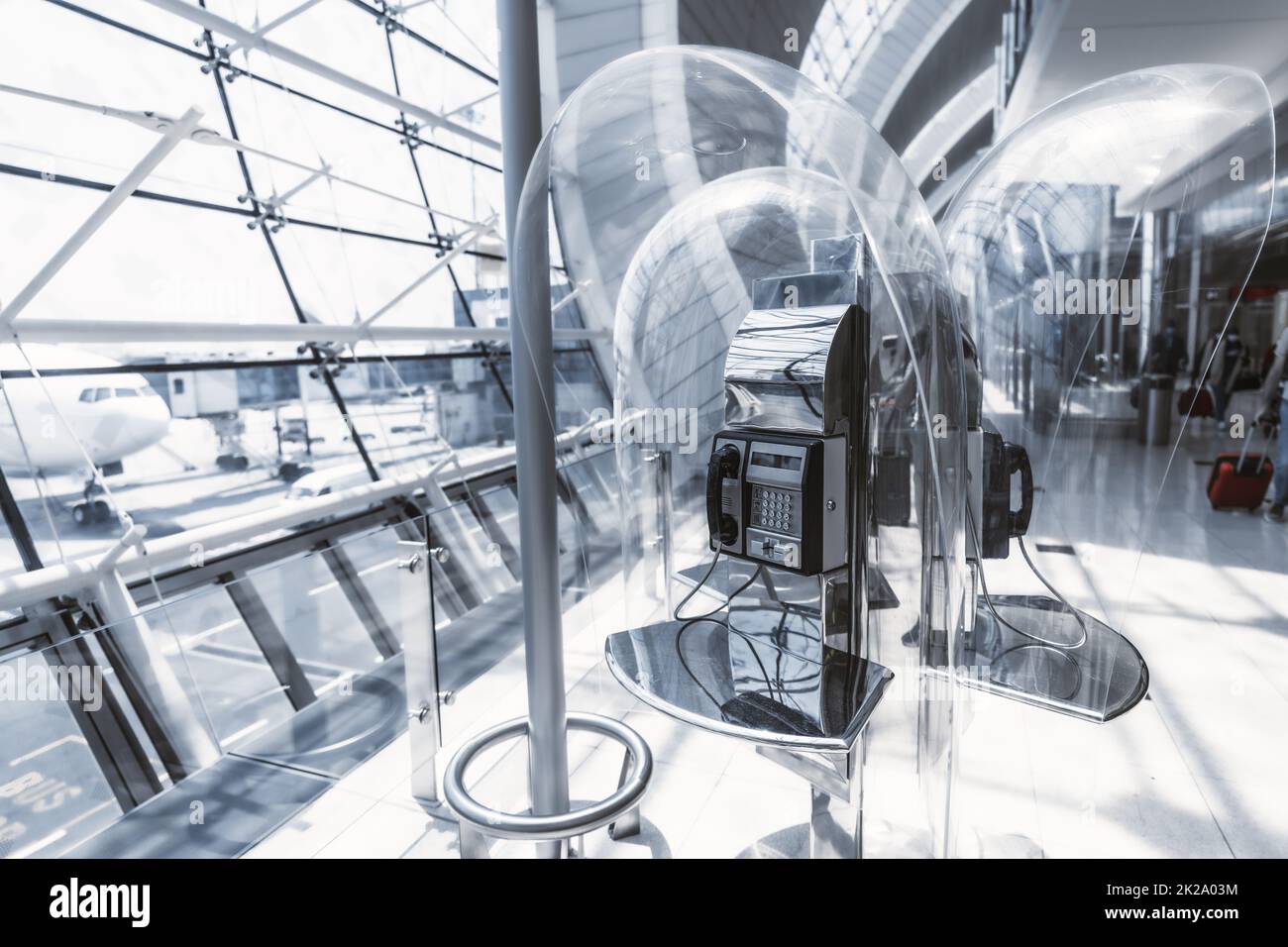 Wide-angle view of a modern phone booth with buttons and a transparent ...