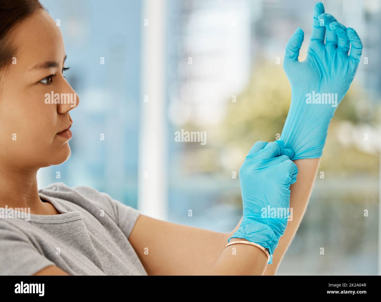 Wearing safety gloves hi-res stock photography and images - Alamy