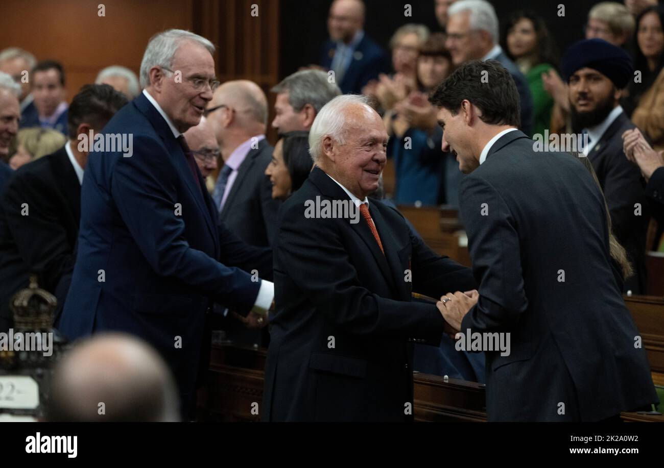 Prime Minister Justin Trudeau shakes hands with Yvan Cournoyer and ...