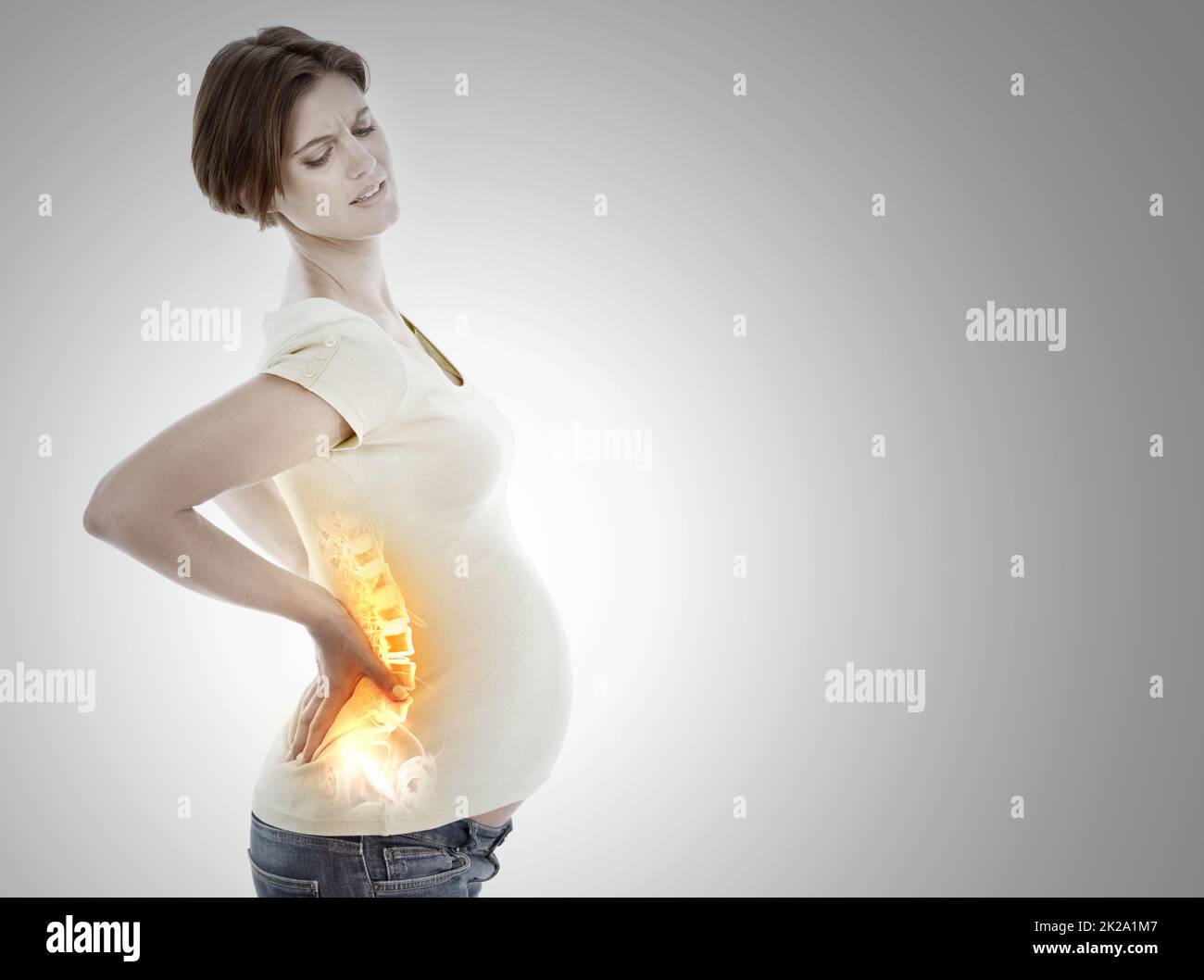 Pregnant Woman Holding Belly In Pain