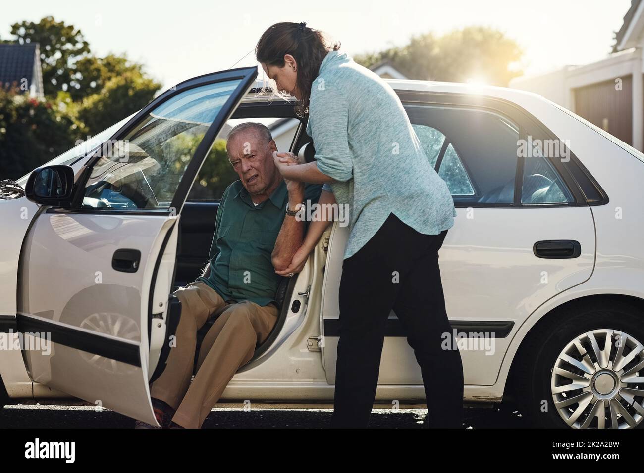 Man helping woman out of car hi-res stock photography and images - Alamy