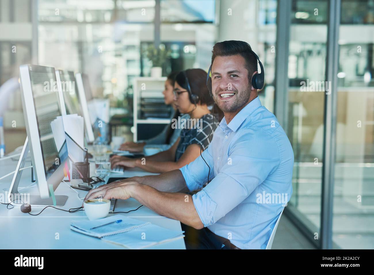 Delivering outstanding customer support day after day. Portrait of a happy and confident young ...