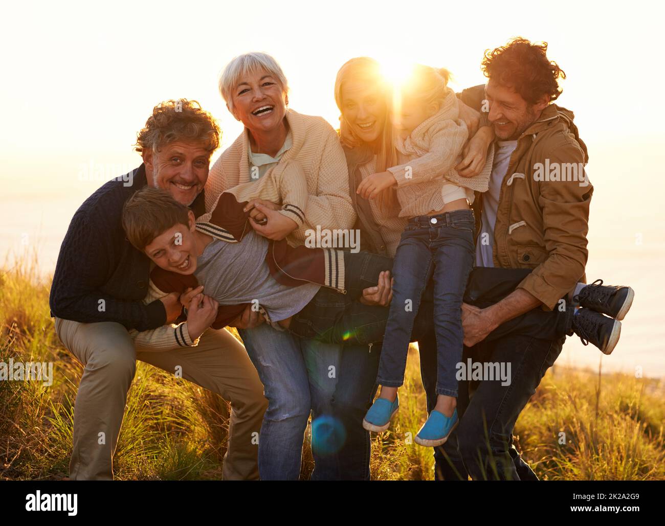 Holding up the family line. Shot of a happy family banding together to ...