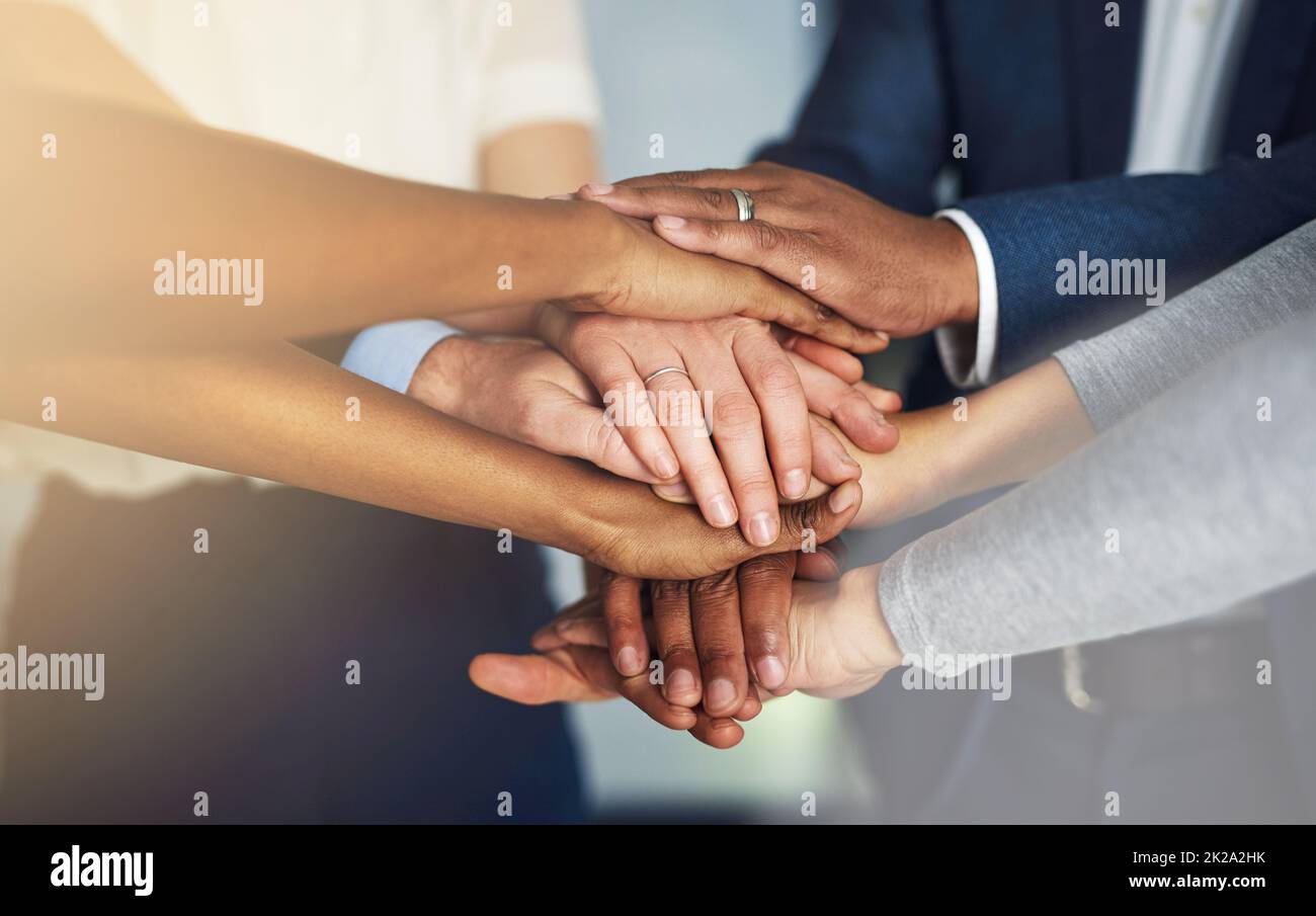 Work together, win together. Cropped shot of a team of colleagues ...