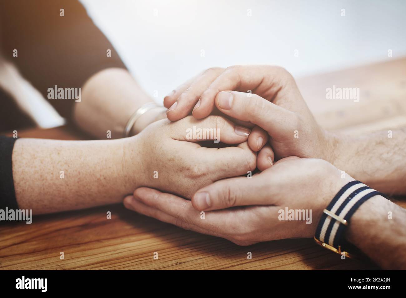 Diverse people holding hands trust hi-res stock photography and images ...