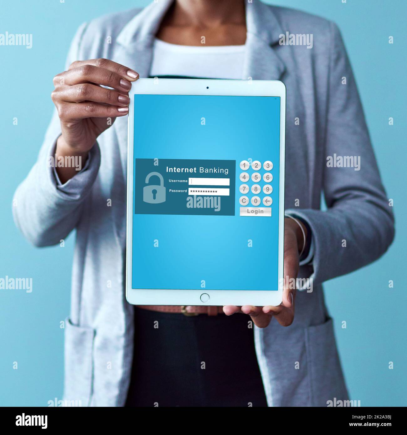 Pay your accounts on your digital tablet. Studio shot of an ...