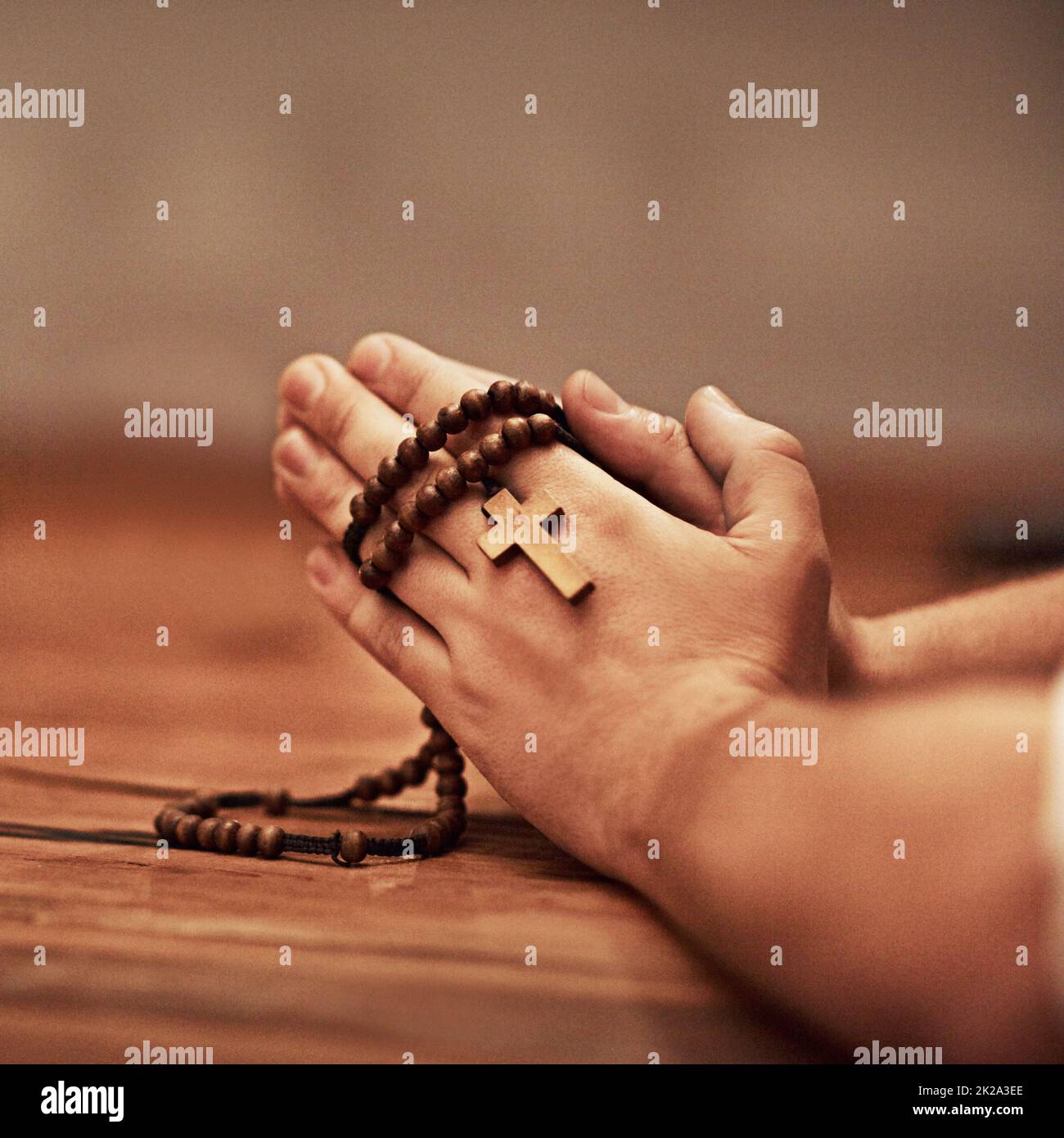 Catholic person praying crucifix hi-res stock photography and images ...