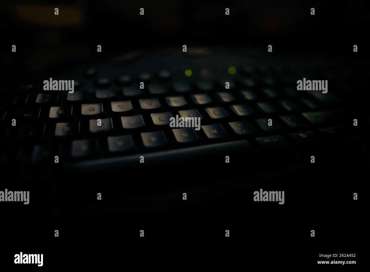 Keyboard in low light Stock Photo - Alamy