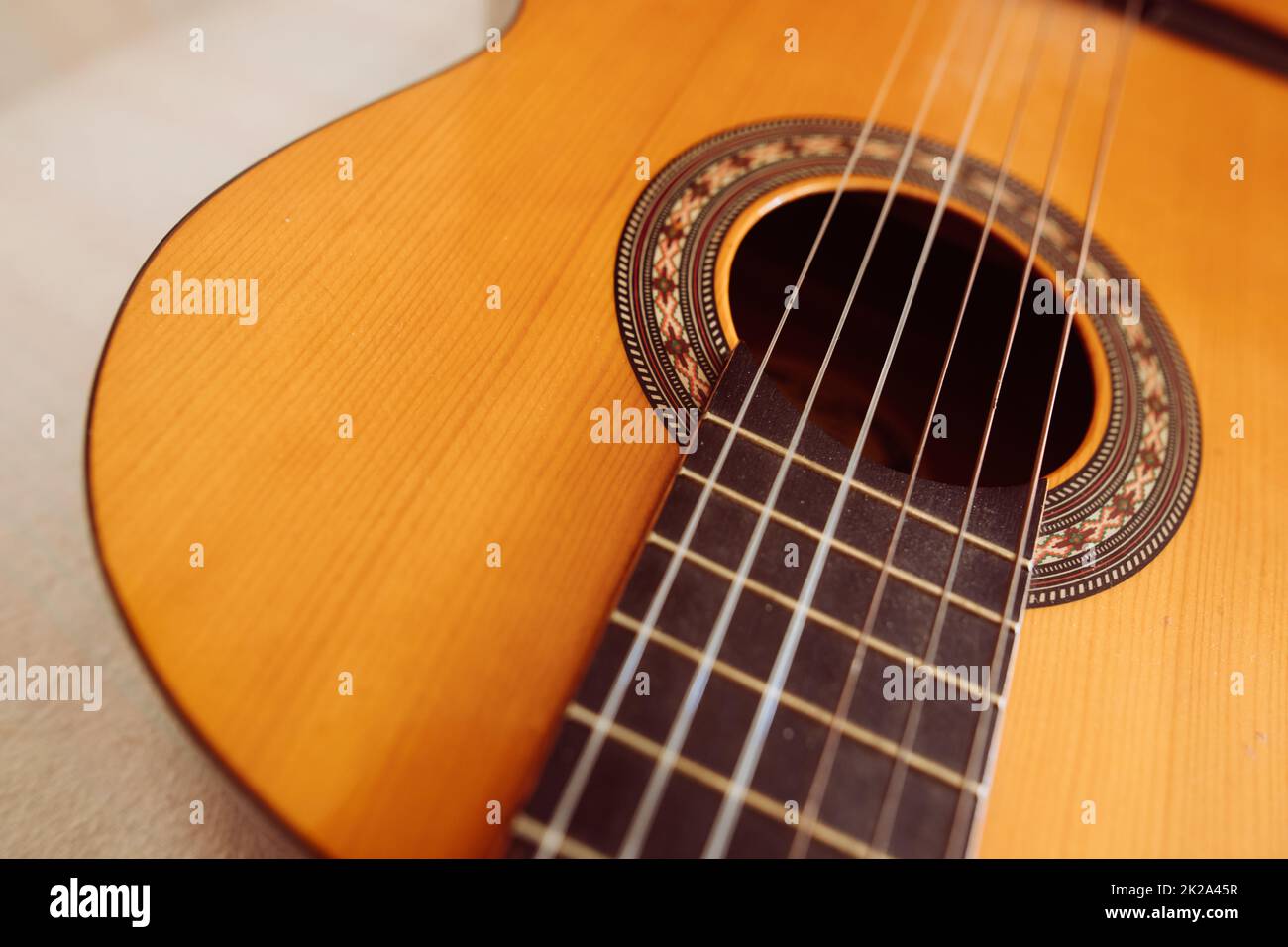 Wooden classical guitar, with plastic strings Stock Photo - Alamy