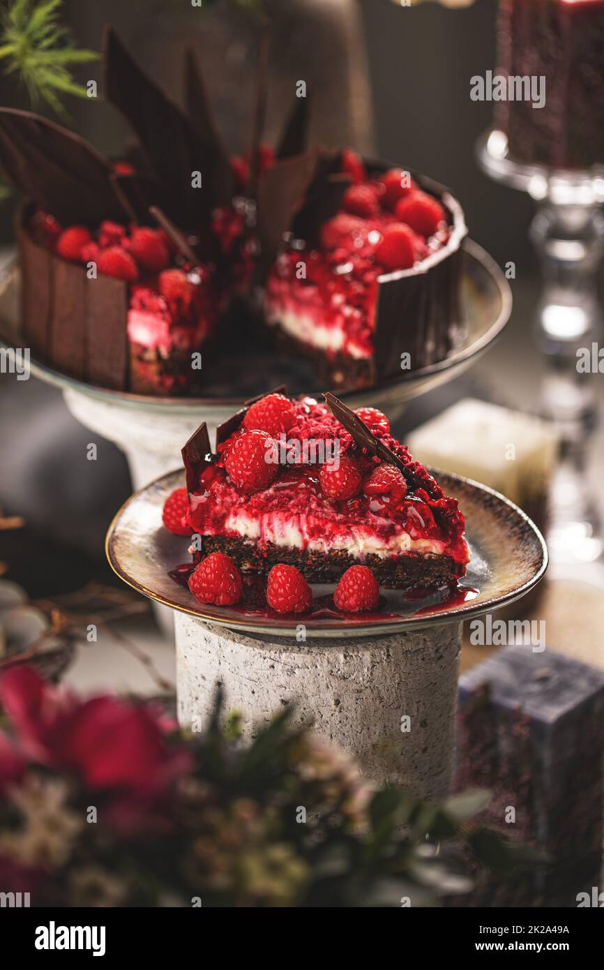 Slice of cheesecake with raspberry sauce Stock Photo - Alamy