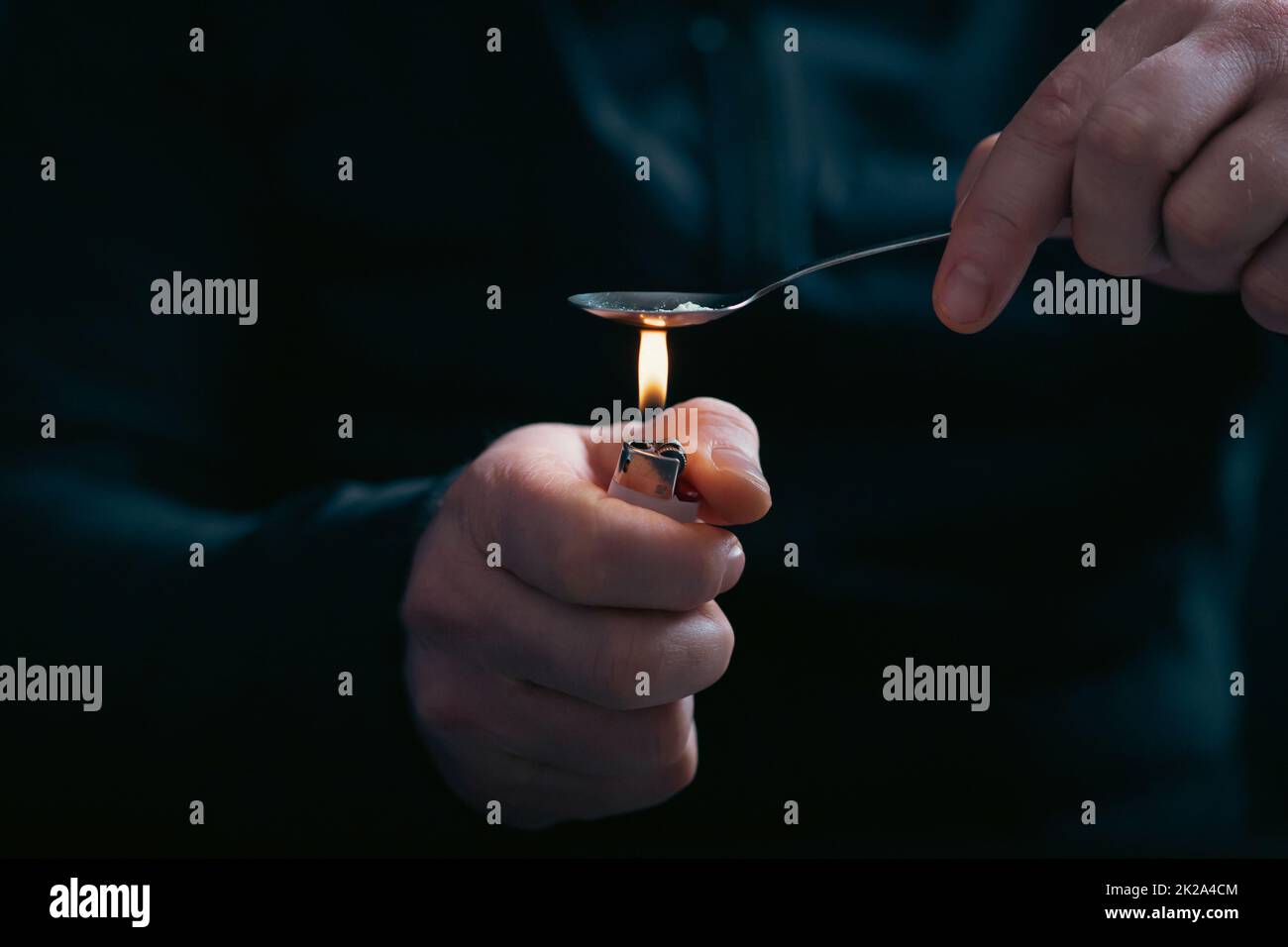 Drug addict man or drug dealer prepares heroin Stock Photo - Alamy