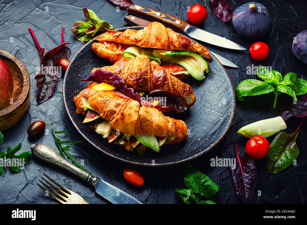 Fresh croissant with meat and fish Stock Photo - Alamy