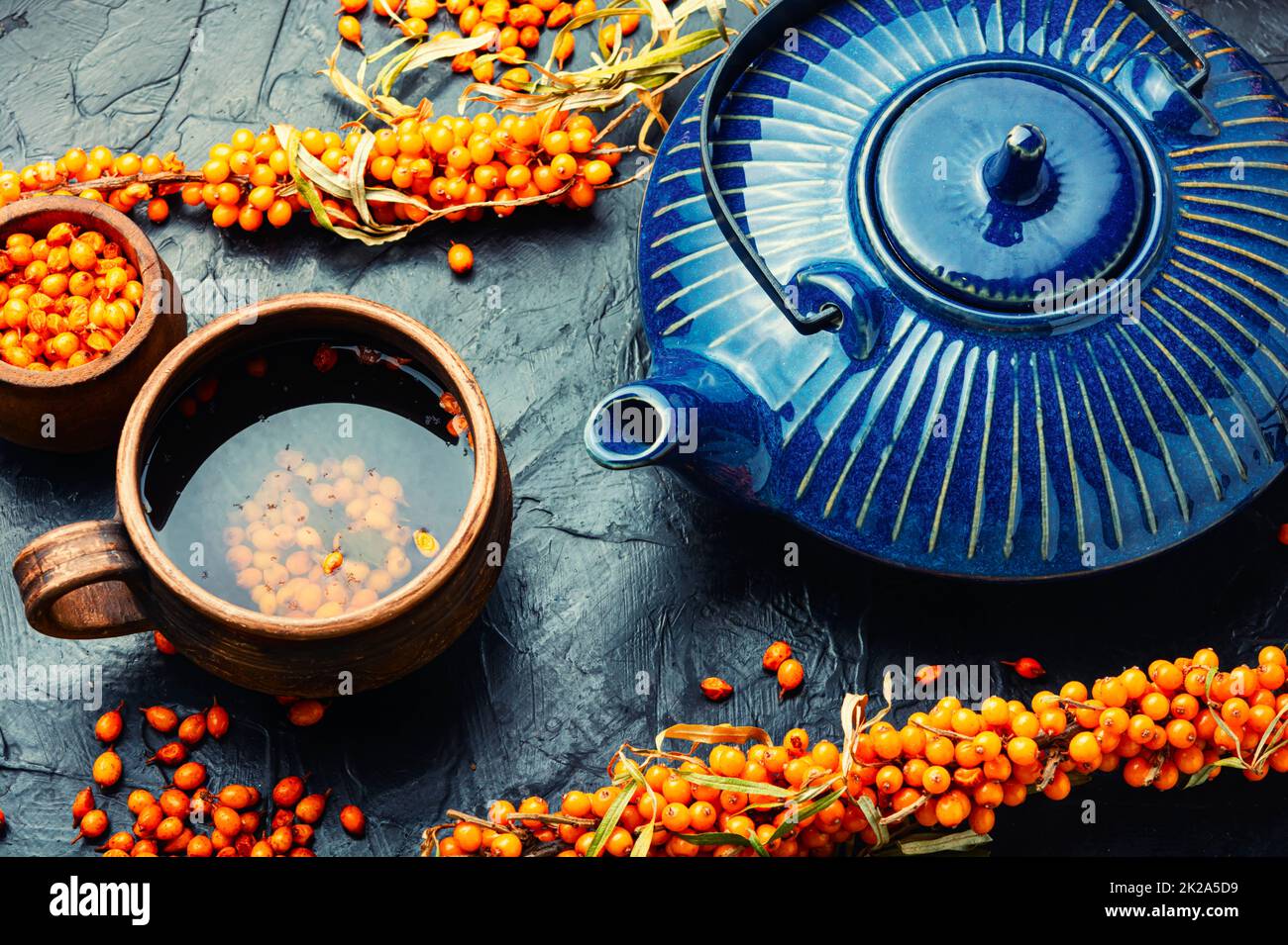 Seasonal medicinal sea buckthorn tea Stock Photo - Alamy